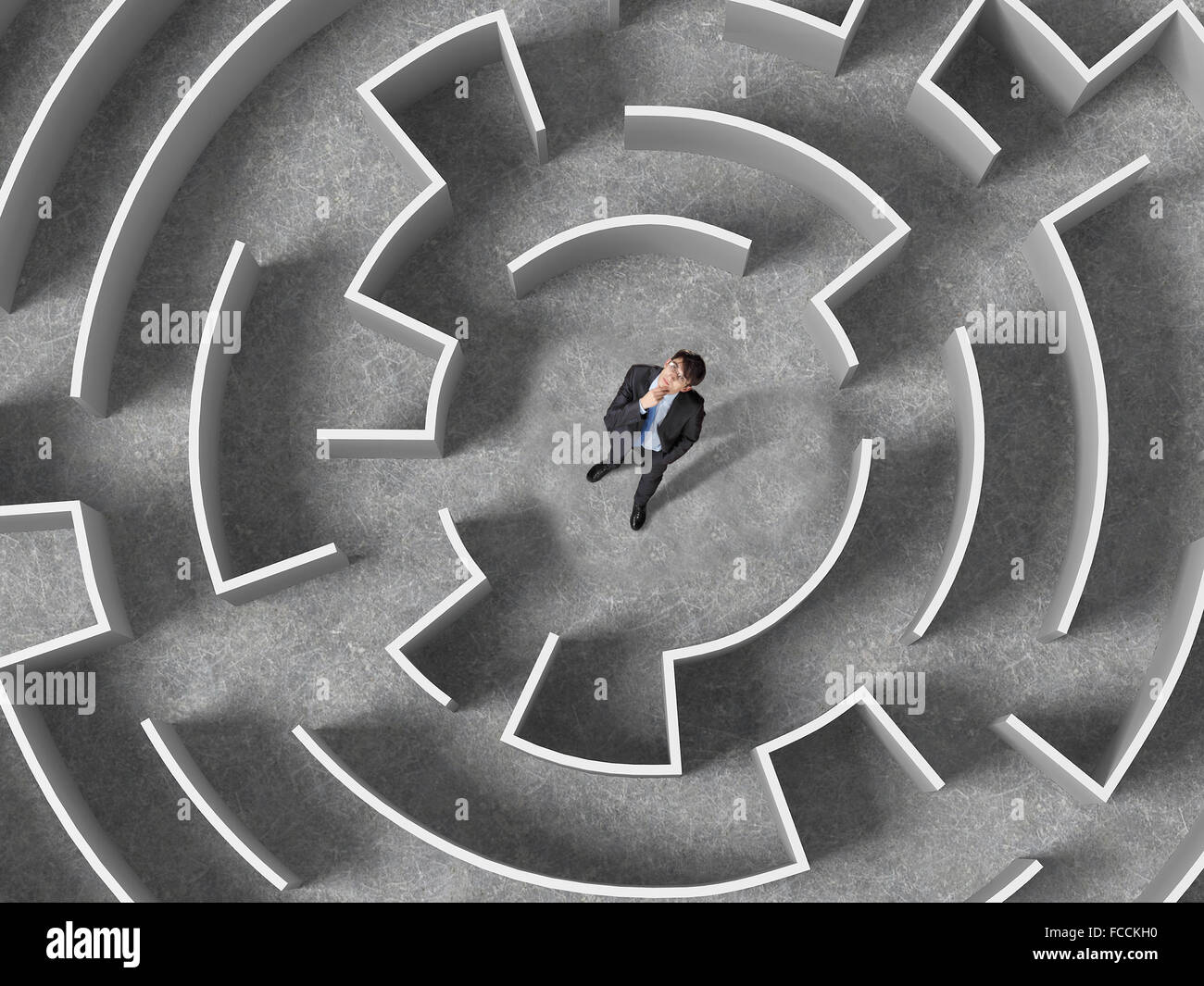Businessman standing in center of the maze hi-res stock photography and ...