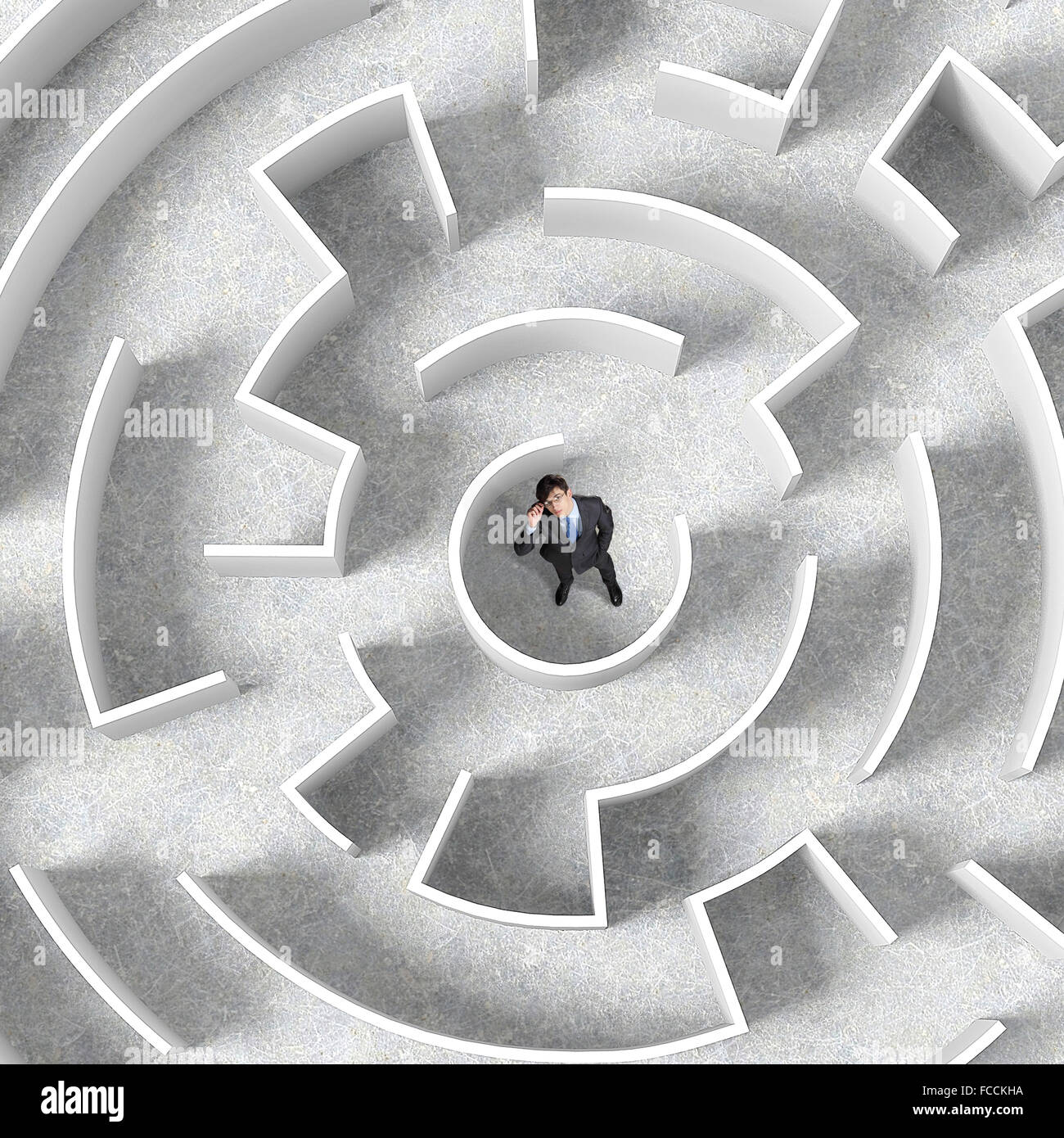 Businessman standing in center of the maze hi-res stock photography and ...