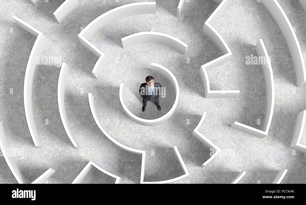 Top view of businessman standing in center of labyrinth Stock Photo - Alamy