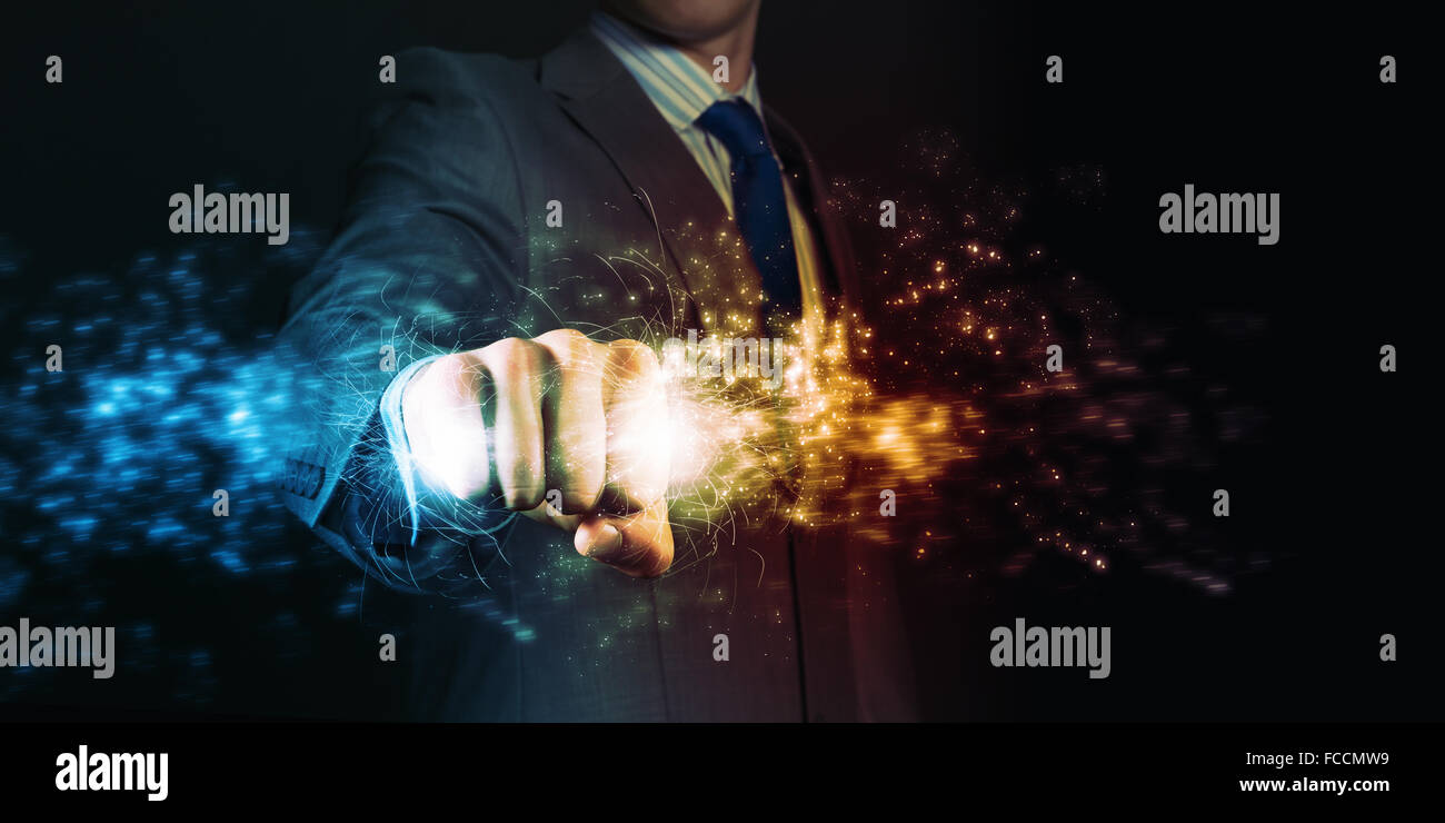 Businessman holding lightning in fist. Power and control Stock Photo ...