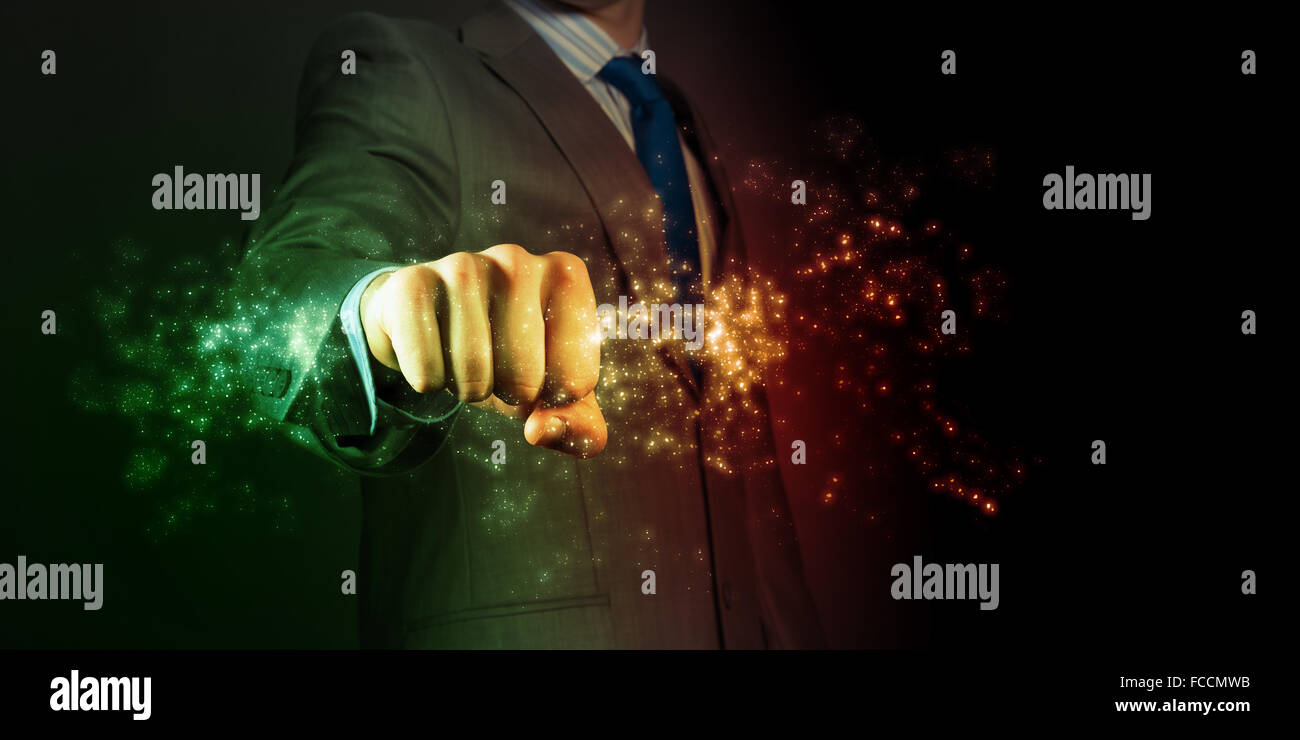 Businessman holding lightning in fist. Power and control Stock Photo ...