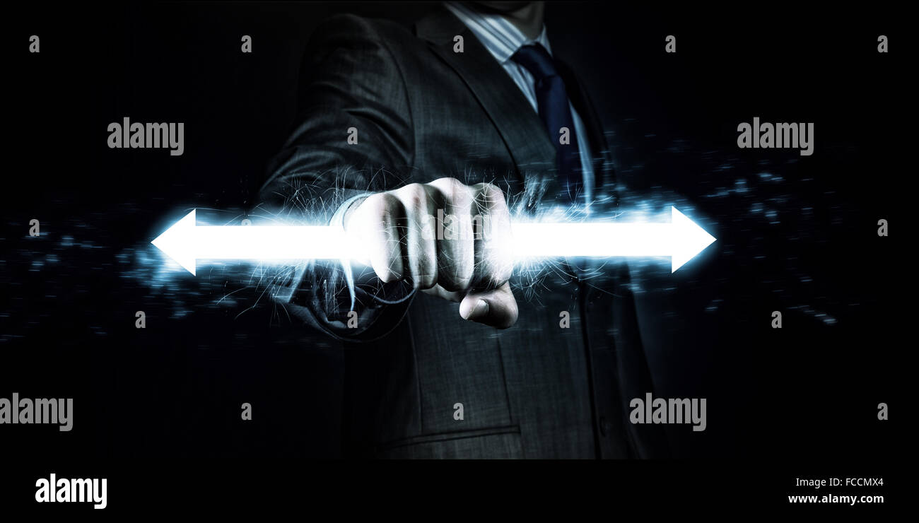Businessman holding lightning in fist hi-res stock photography and ...
