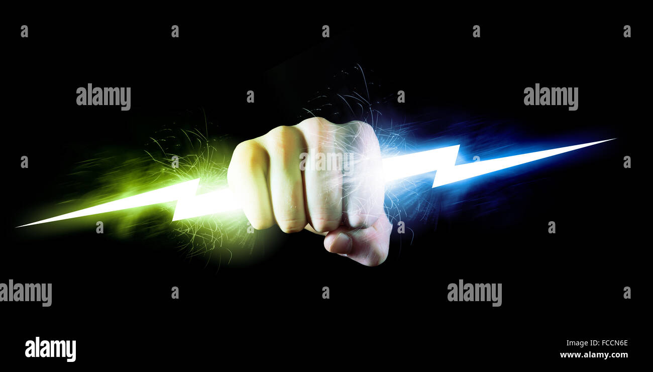 Businessman holding lightning in fist hi-res stock photography and ...