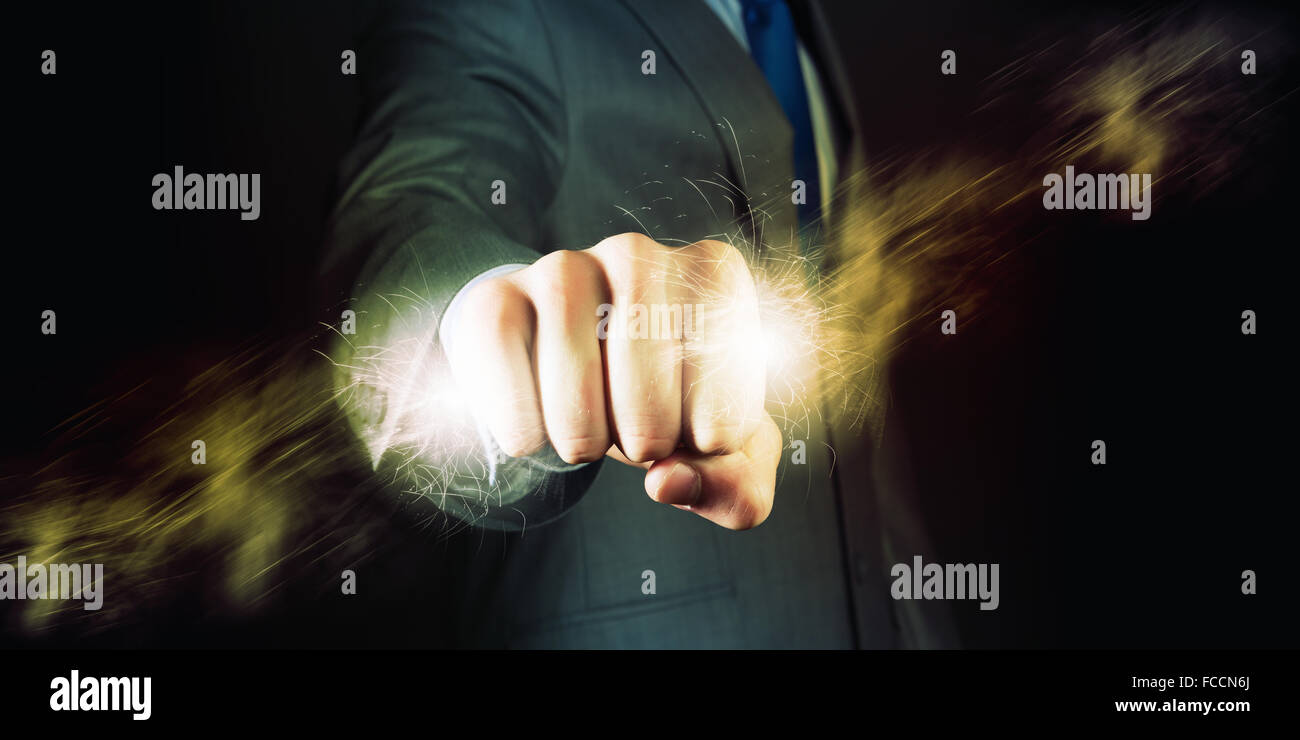 Businessman holding lightning in fist. Power and control Stock Photo ...
