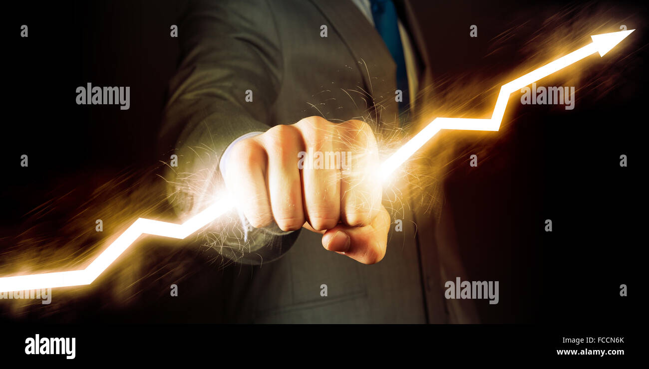 Businessman holding lightning in fist. Power and control Stock Photo ...