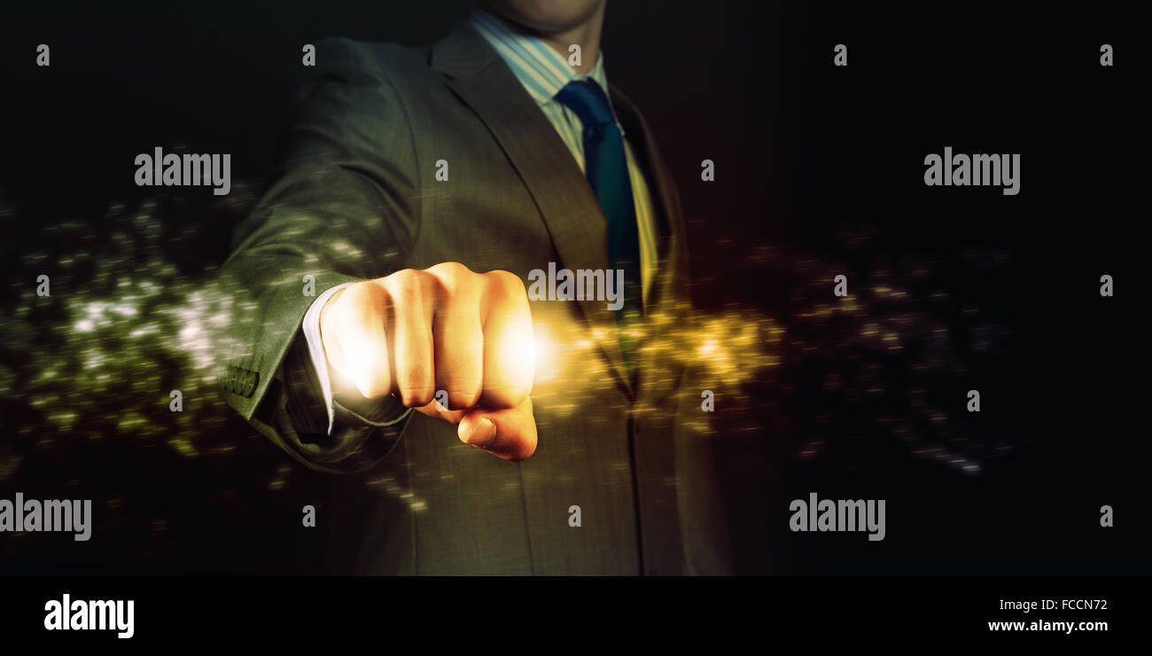 Businessman holding lightning in fist. Power and control Stock Photo ...