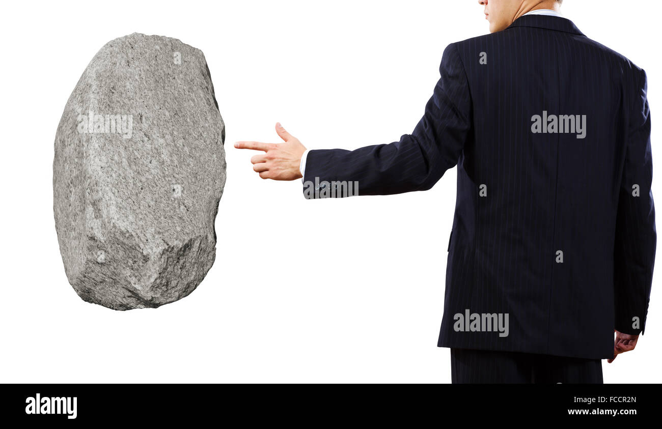 Boy pushing rock hi-res stock photography and images - Alamy