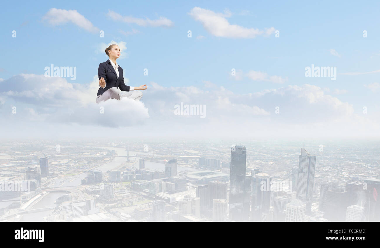 Young attractive woman sitting on cloud and meditating Stock Photo - Alamy