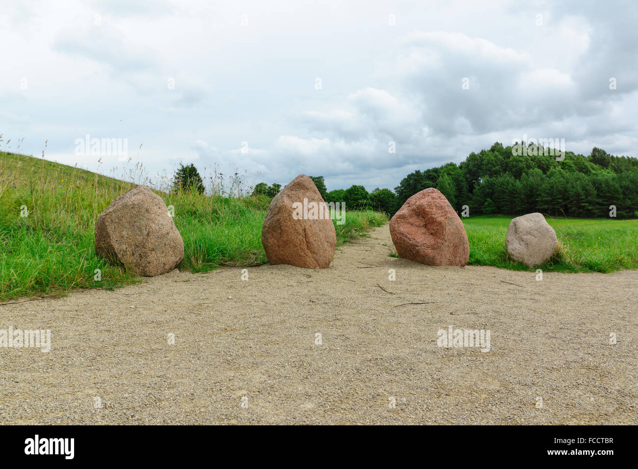 view of huge stones and the hill behind them Stock Photo - Alamy