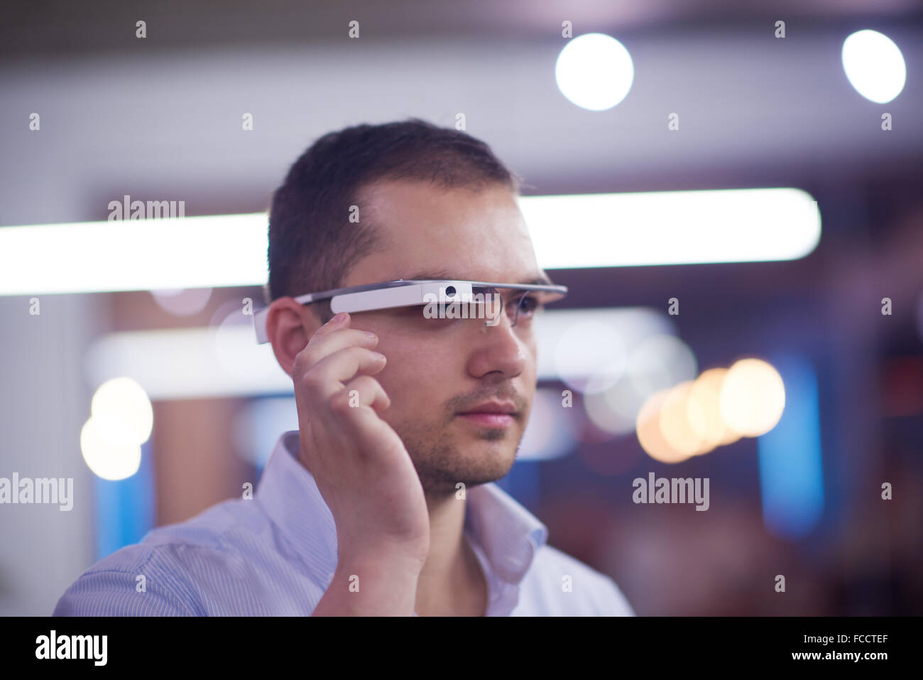 young man using virtual reality gadget computer technology glasses ...