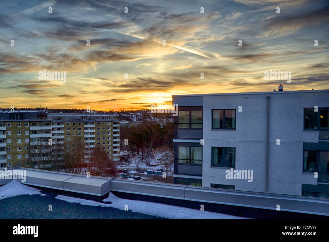 Sun Setting Over City Stock Photo - Alamy