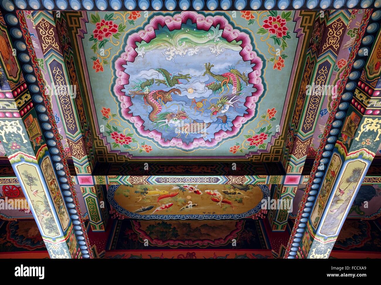 The entrance hall of a Chinese temple is decorated with colorful ...