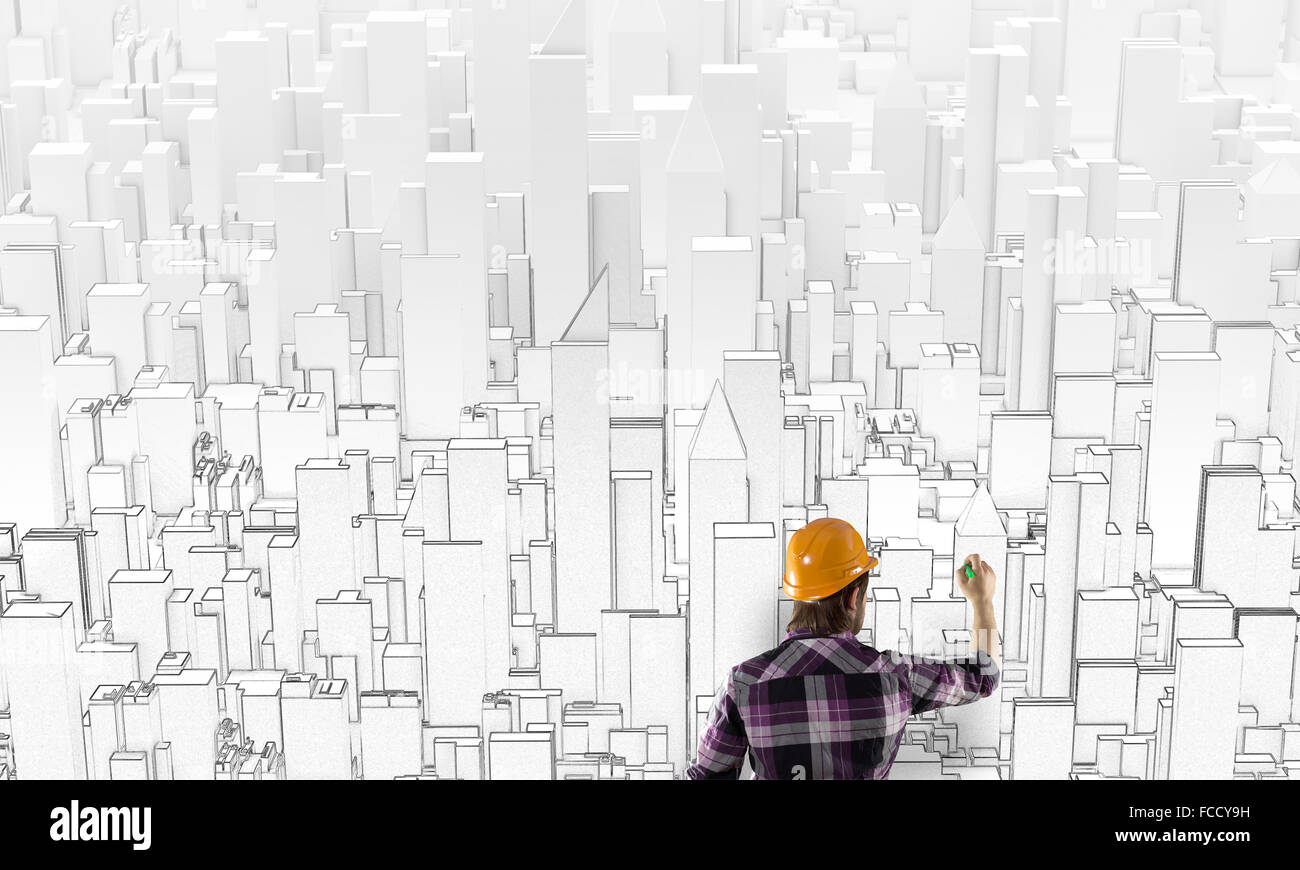 Back view of man engineer drawing buildings Stock Photo - Alamy