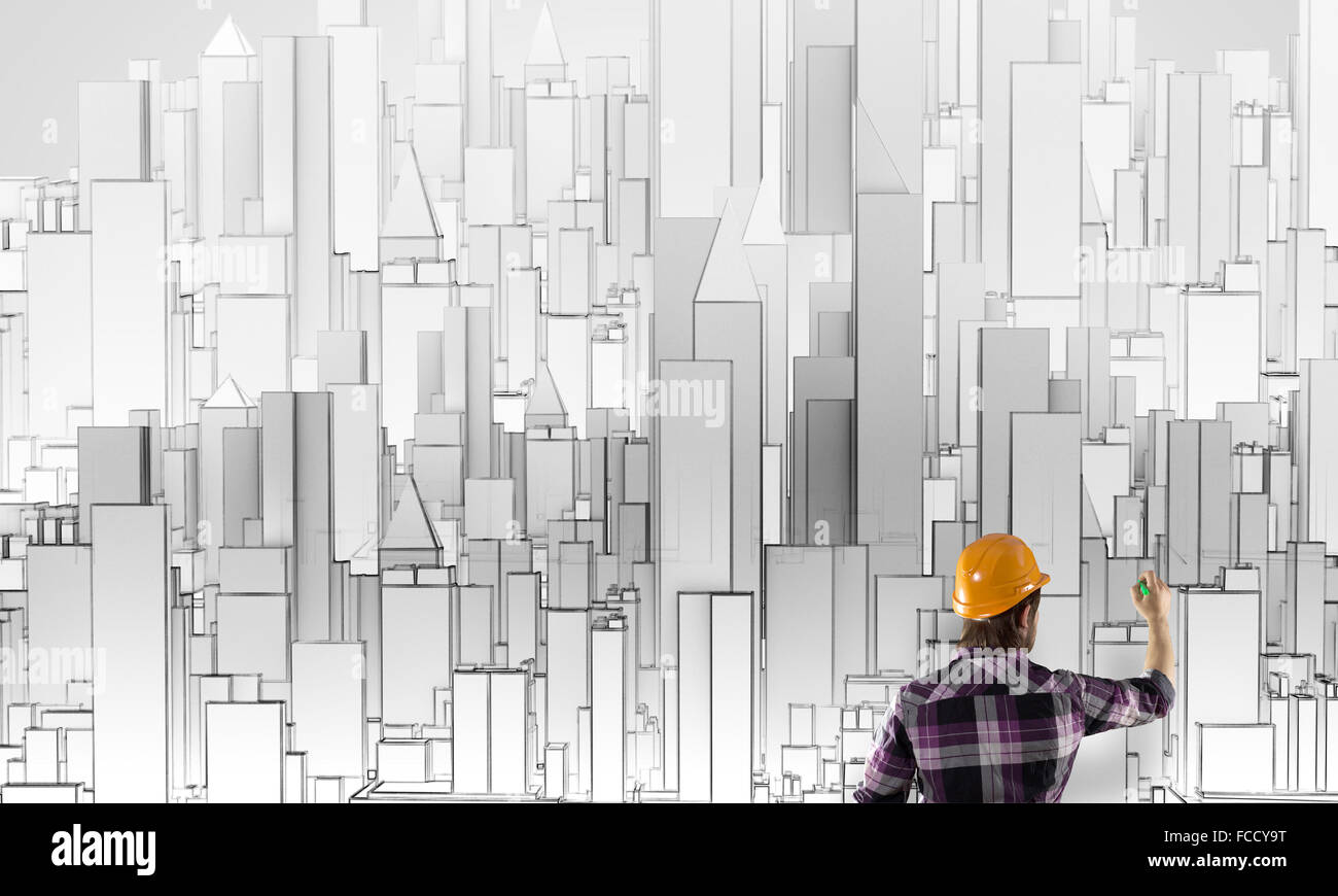 Back view of man engineer drawing buildings Stock Photo - Alamy