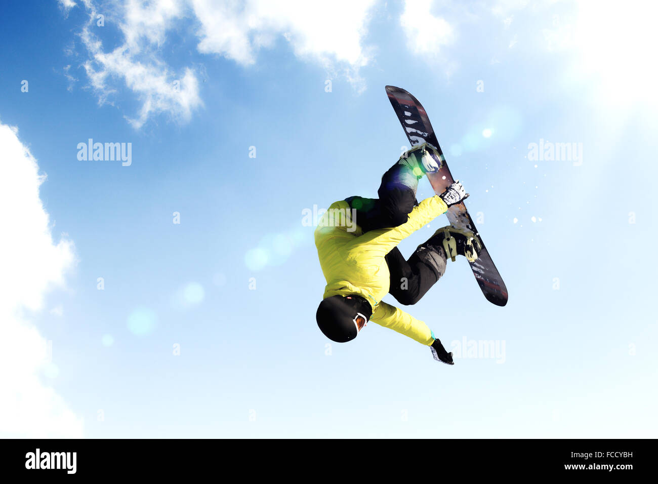 Snowboarder making jump high in clear sky Stock Photo - Alamy