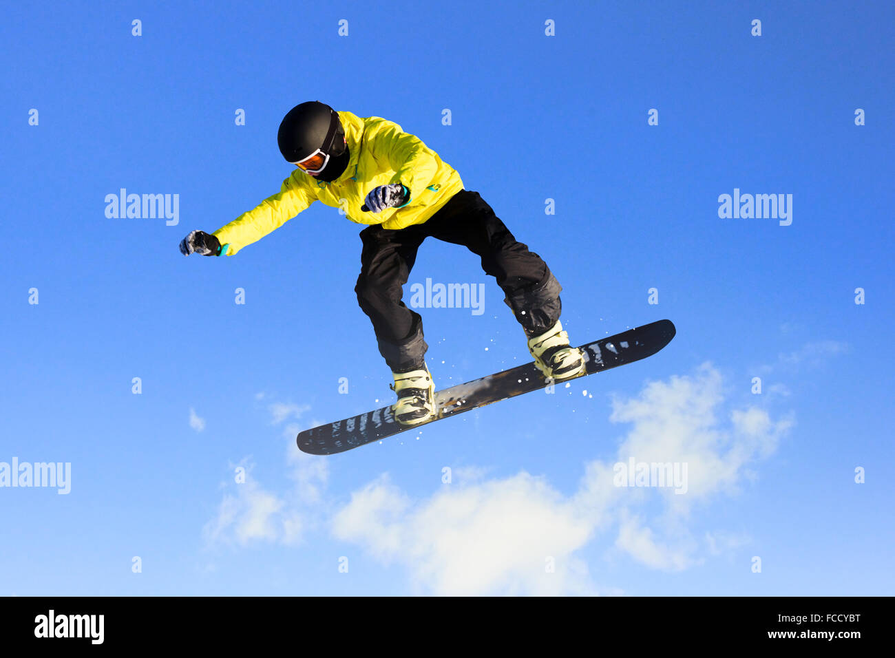 Snowboarder making jump high in clear sky Stock Photo - Alamy