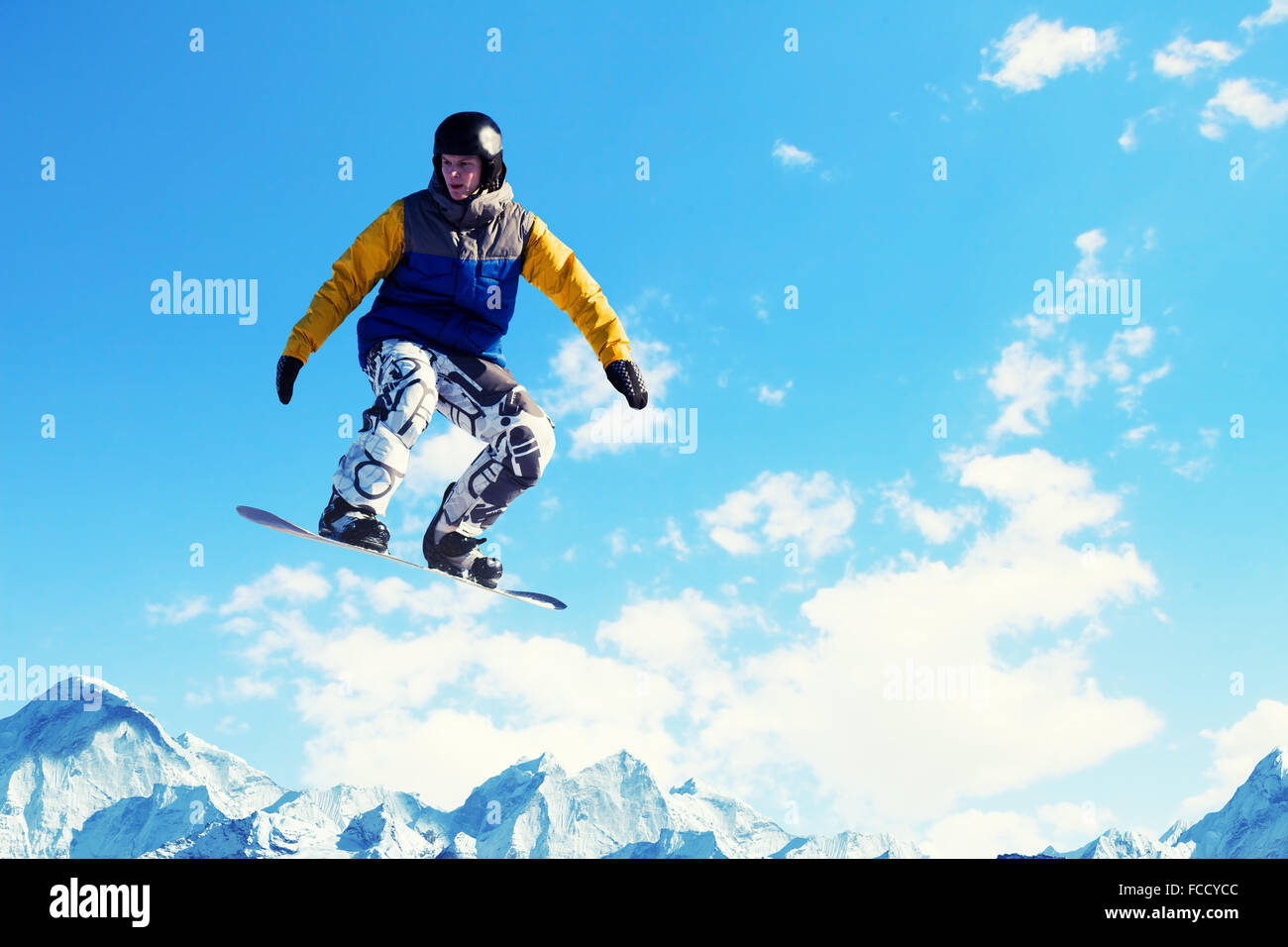 Snowboarder making jump high in clear sky Stock Photo - Alamy