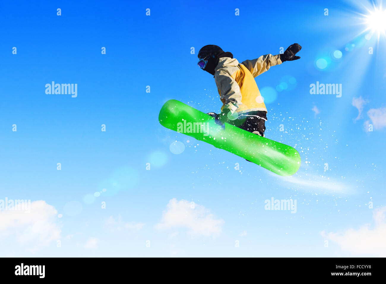 Snowboarder making jump high in clear sky Stock Photo - Alamy