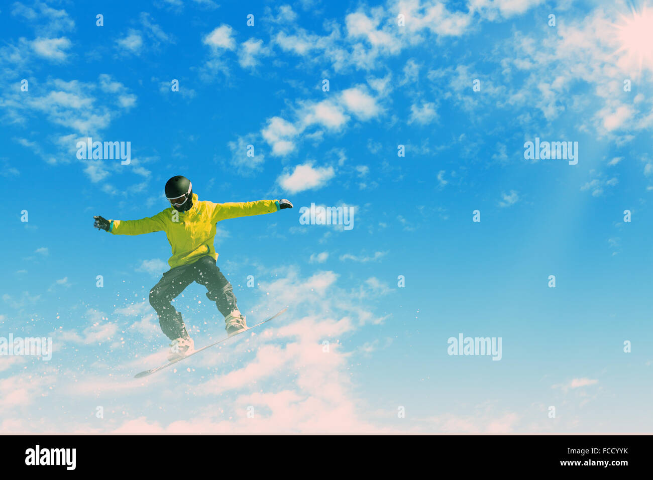 Snowboarder making jump high in clear sky Stock Photo - Alamy