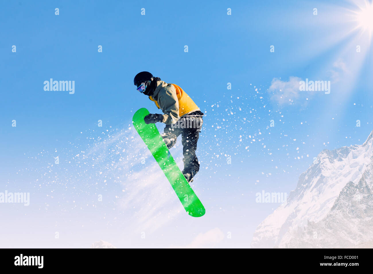 Snowboarder making jump high in clear sky Stock Photo - Alamy