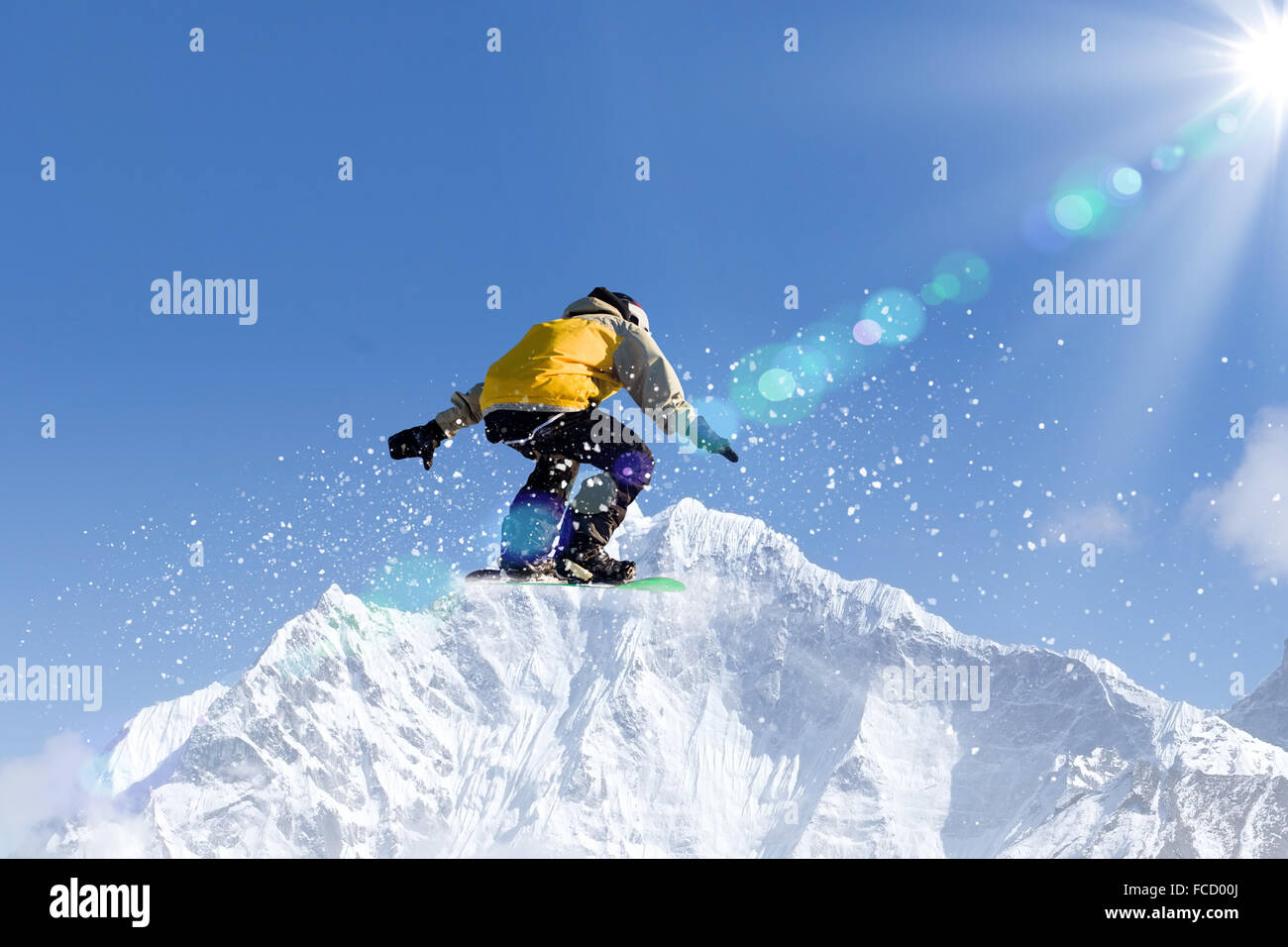 Snowboarder making jump high in clear sky Stock Photo - Alamy