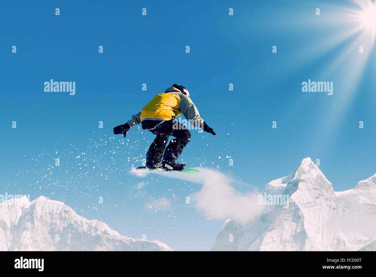 Snowboarder making jump high in clear sky Stock Photo - Alamy