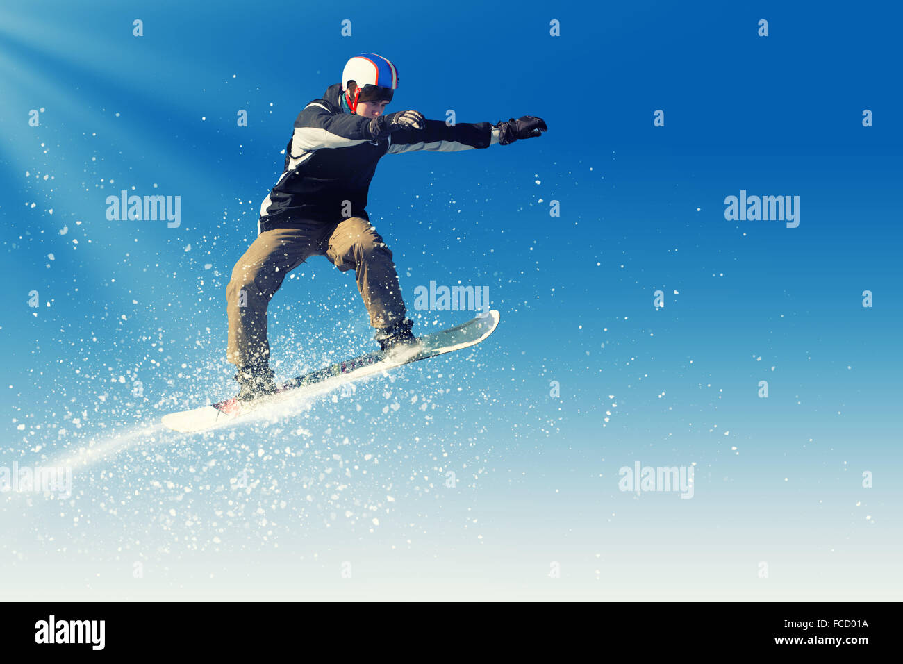Snowboarder making jump high in clear sky Stock Photo - Alamy