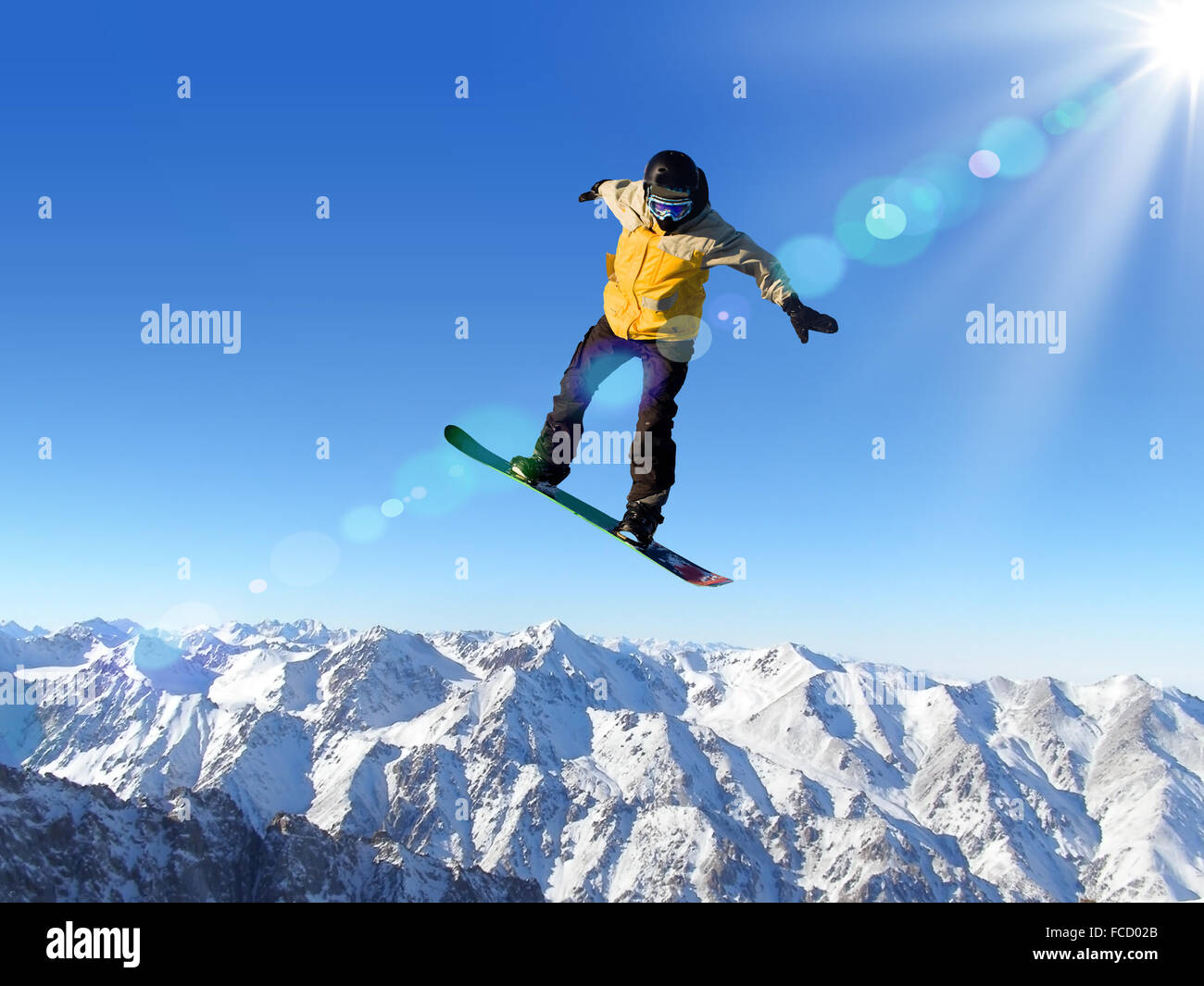 Snowboarder making jump high in clear sky Stock Photo - Alamy