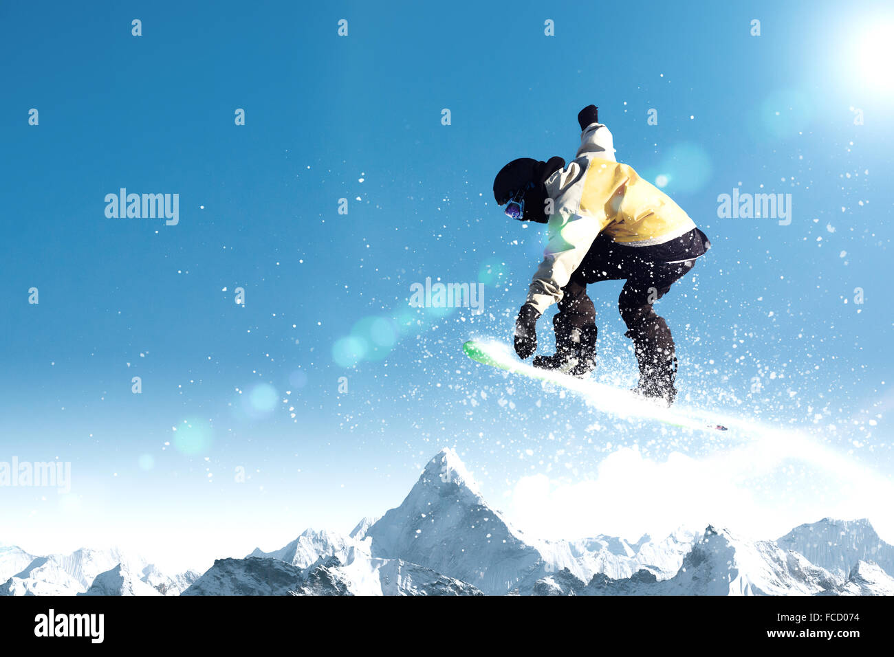 Snowboarder making jump high in clear sky Stock Photo - Alamy