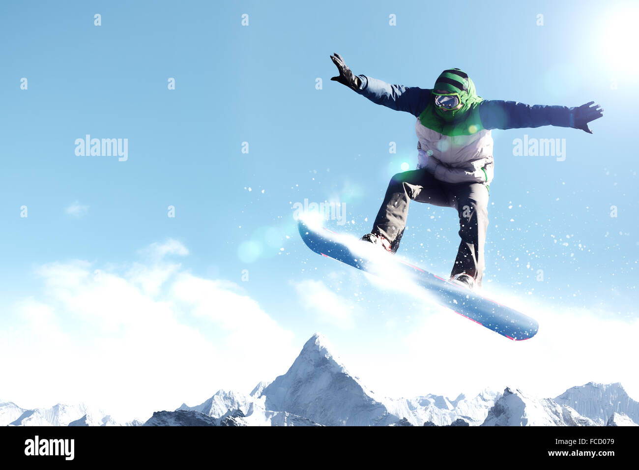 Snowboarder making jump high in clear sky Stock Photo - Alamy