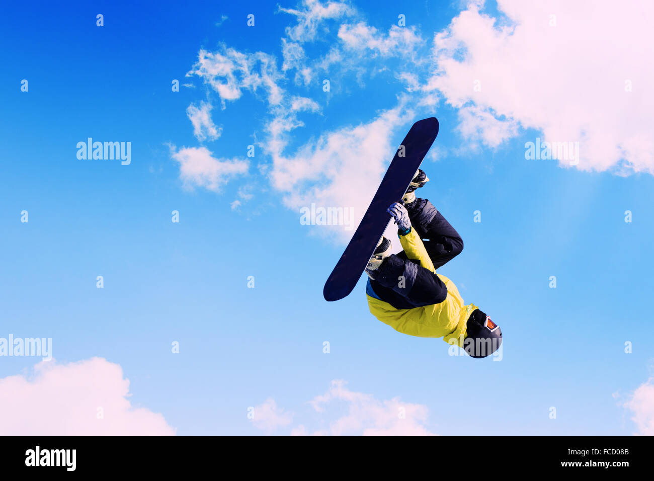 Snowboarder making jump high in clear sky Stock Photo - Alamy