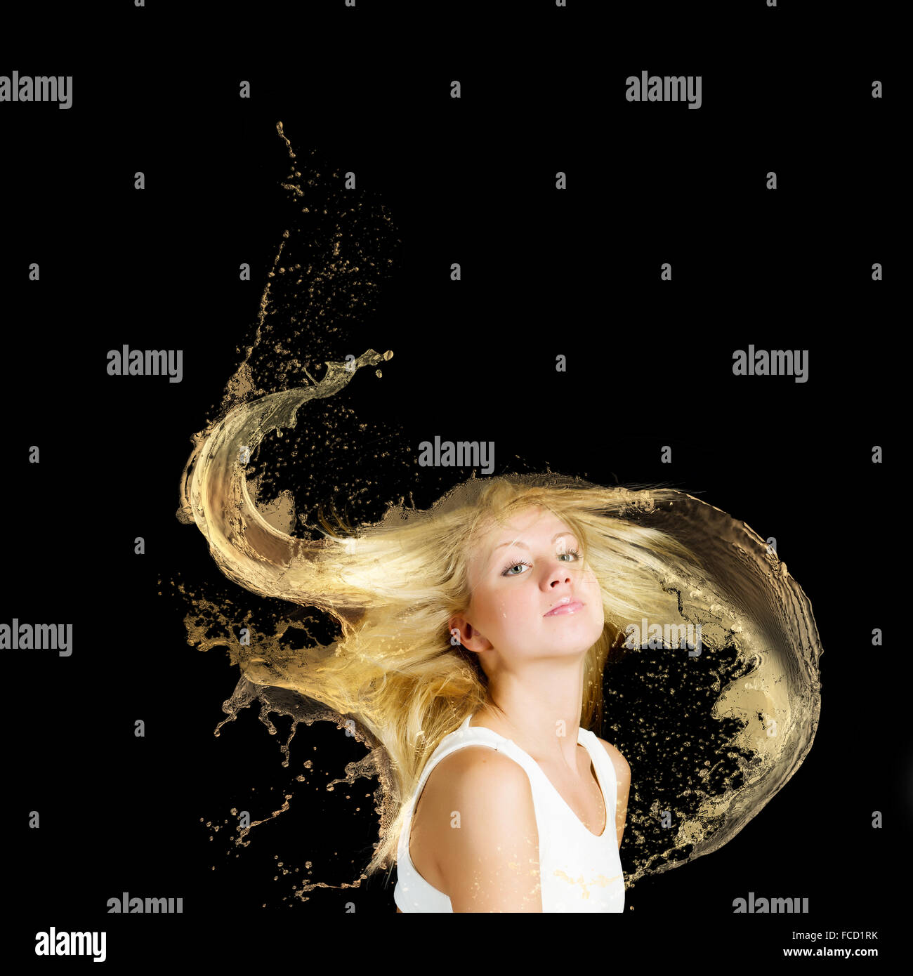Young attractive blond woman with hair in splashes Stock Photo - Alamy