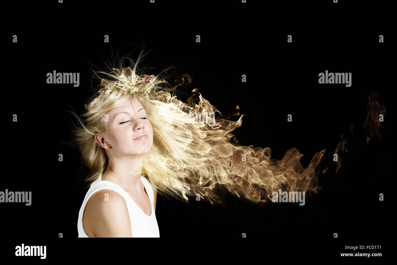 Young attractive blond woman with hair in fire flames Stock Photo - Alamy