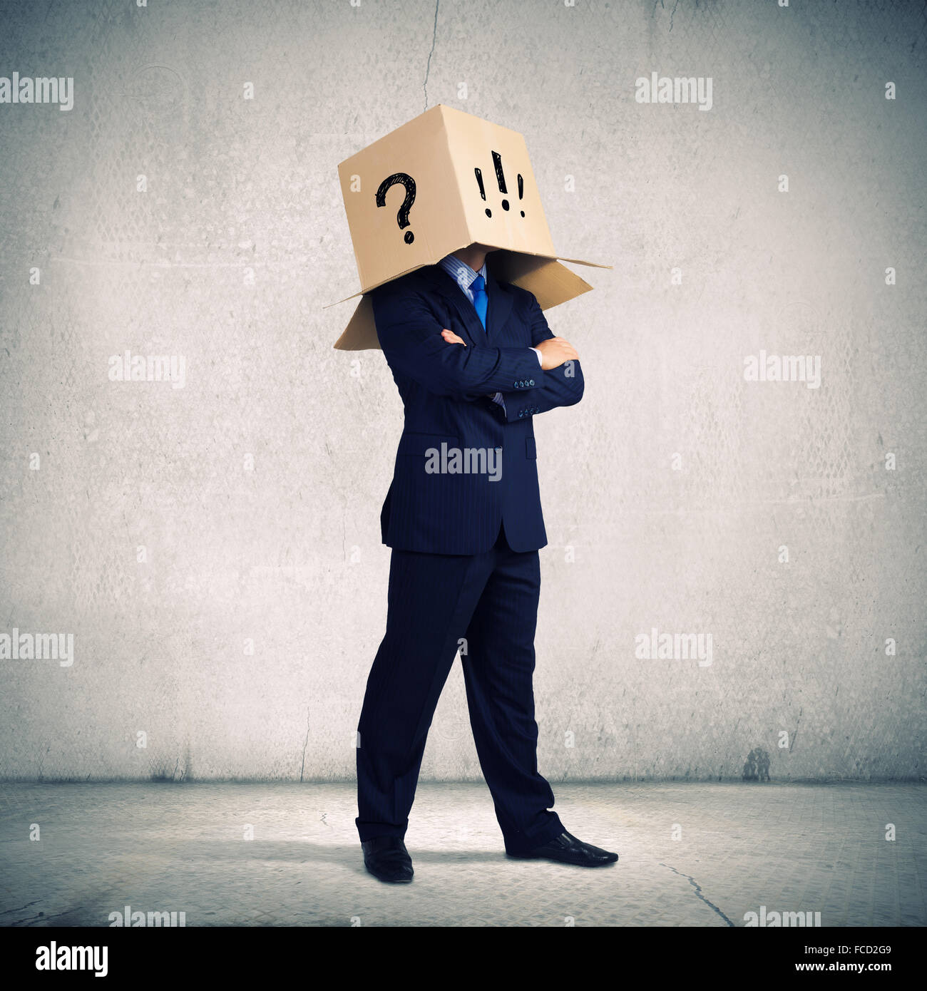 Businessman wearing on head carton box with marks Stock Photo - Alamy