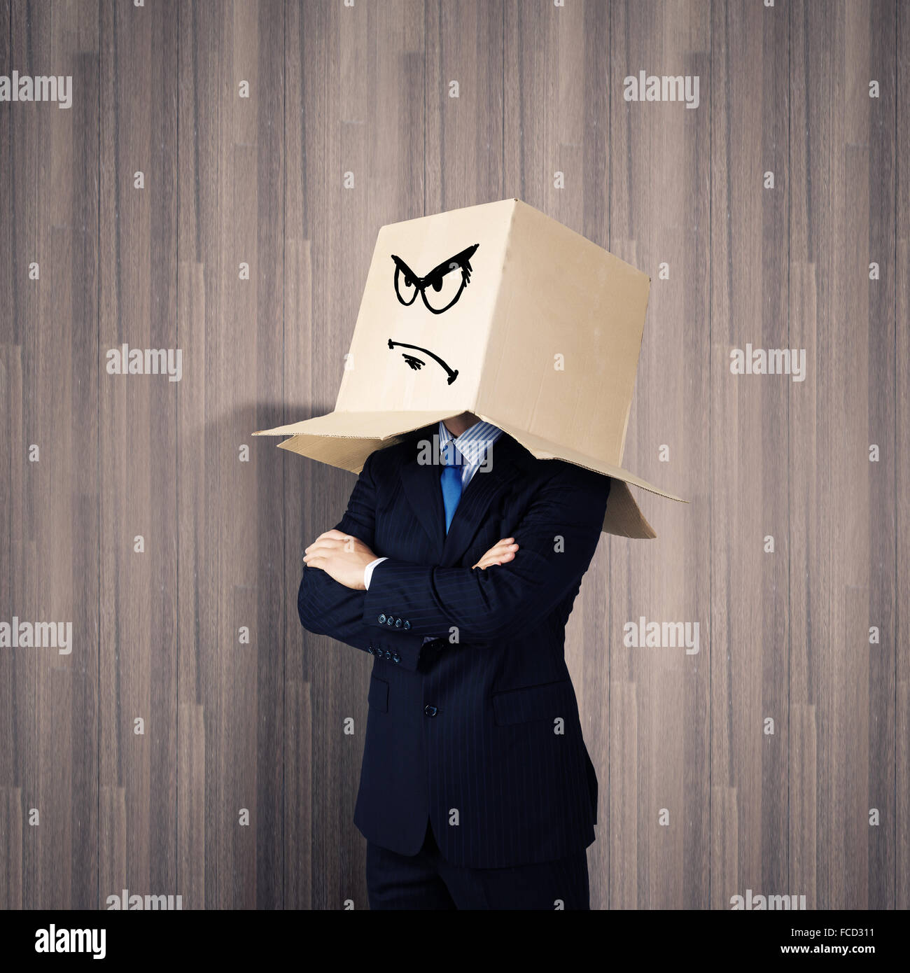 Businessman wearing carton box with smileys on head Stock Photo - Alamy