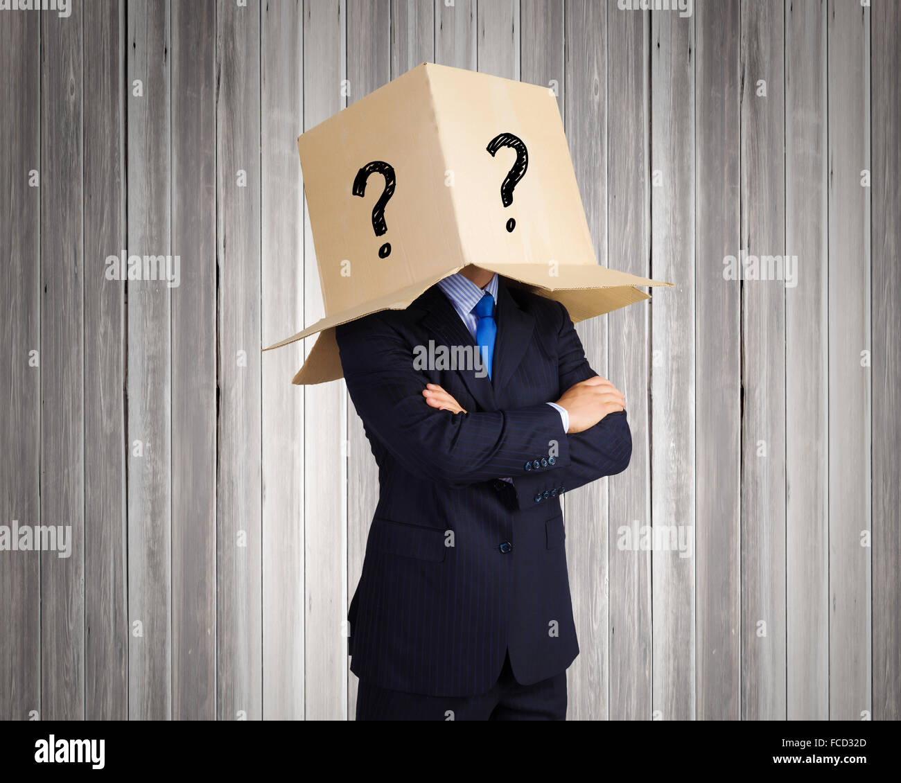 Businessman wearing on head carton box with marks Stock Photo - Alamy
