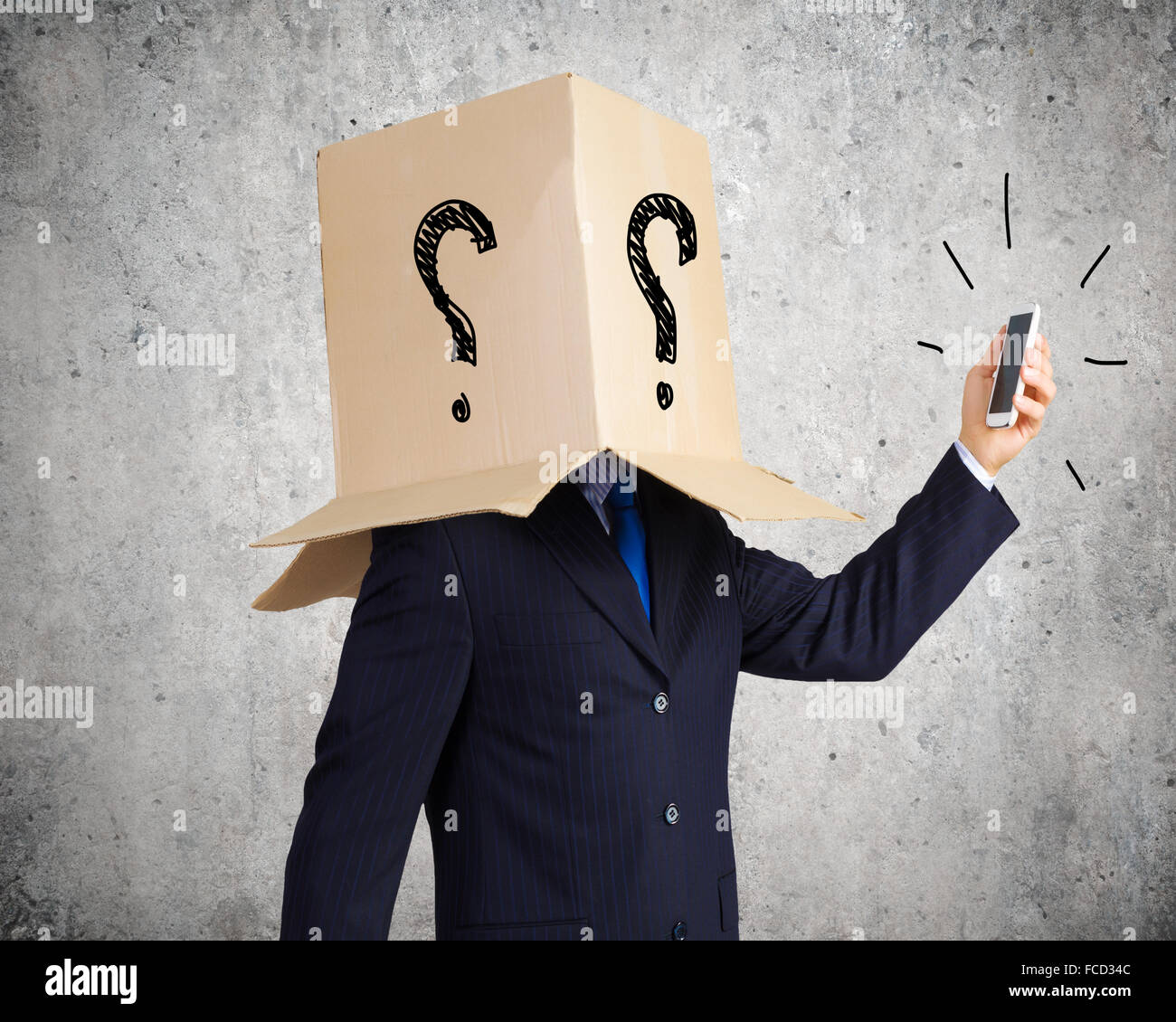 Businessman using mobile phone wearing carton box on head Stock Photo ...