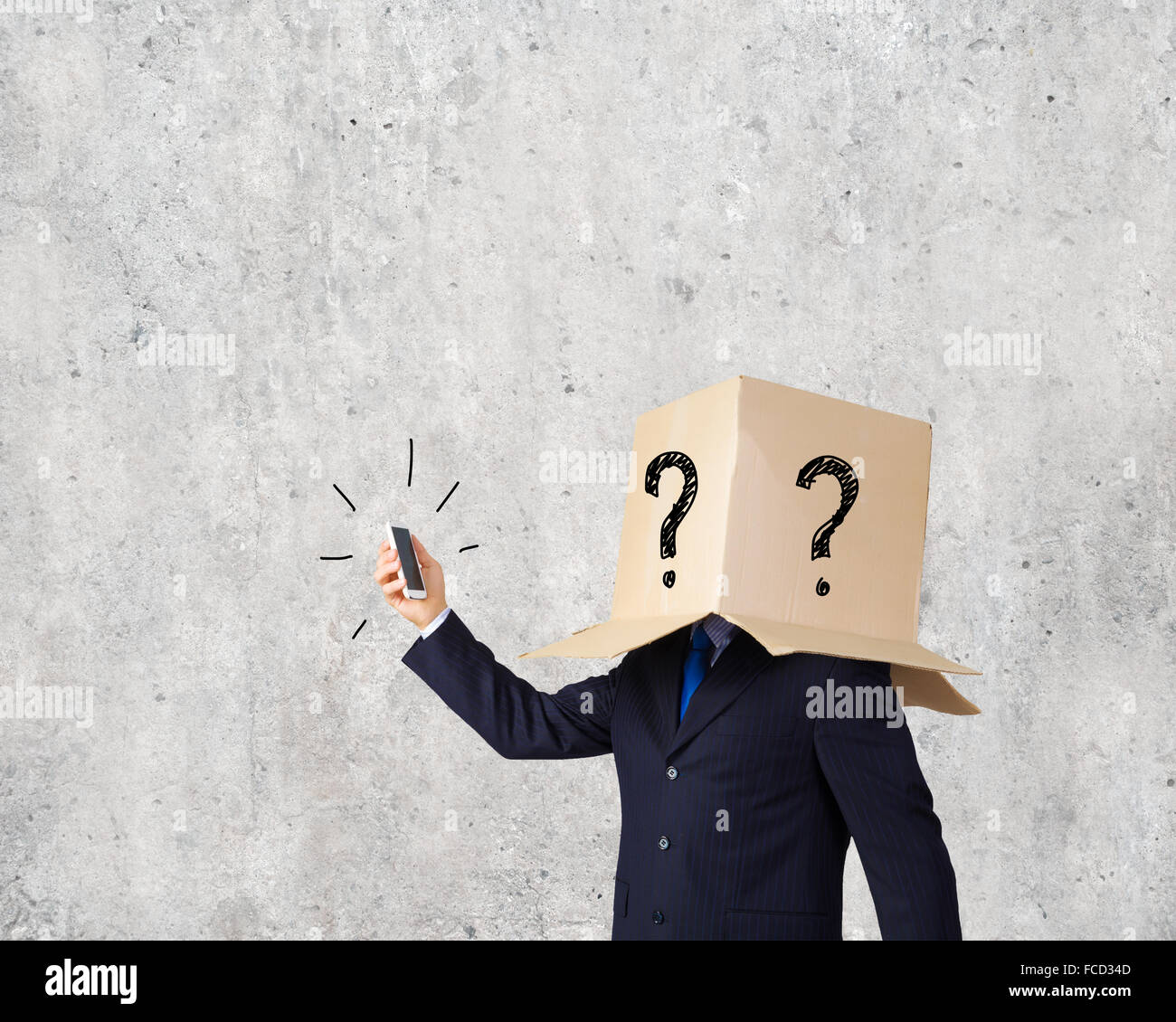 Businessman using mobile phone wearing carton box on head Stock Photo ...