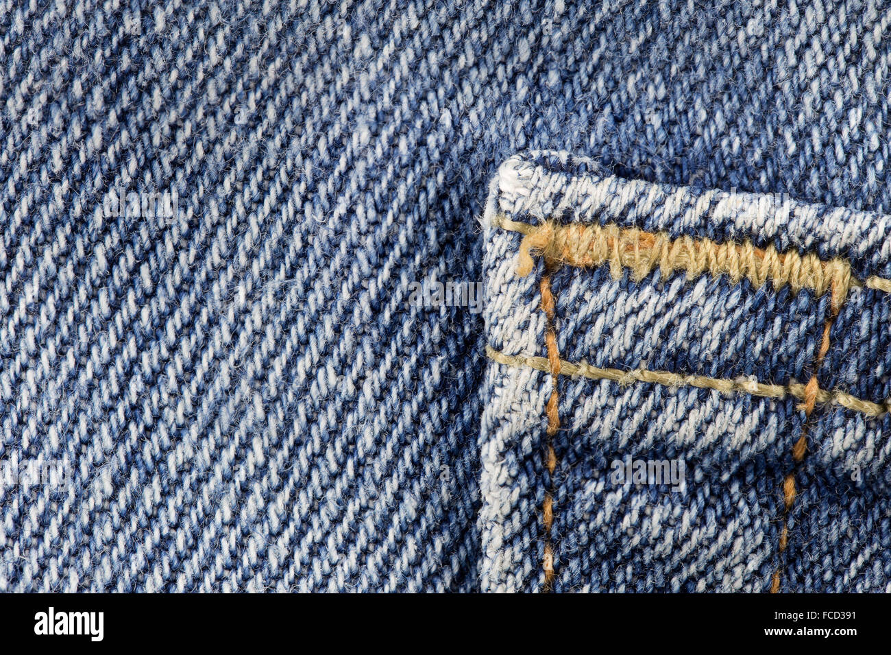Close up onto surface and seam of light blue denim fabric Stock Photo ...