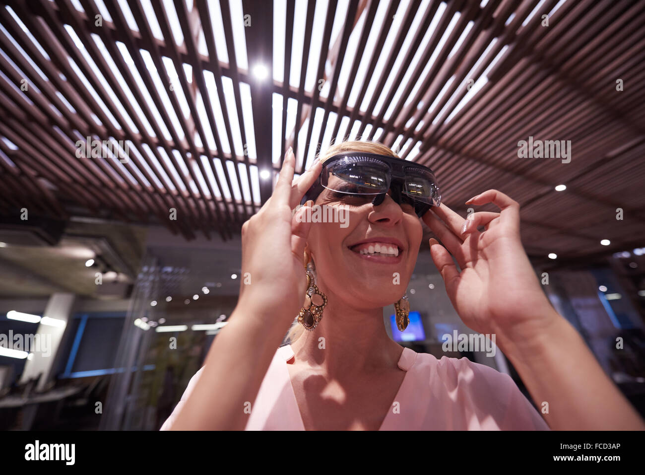 young woman using virtual reality gadget computer technology glasses ...