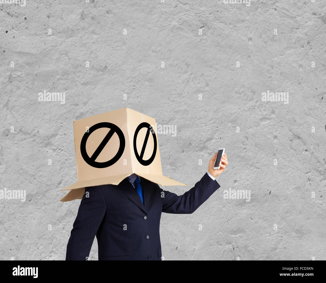 Businessman using mobile phone wearing carton box on head Stock Photo ...