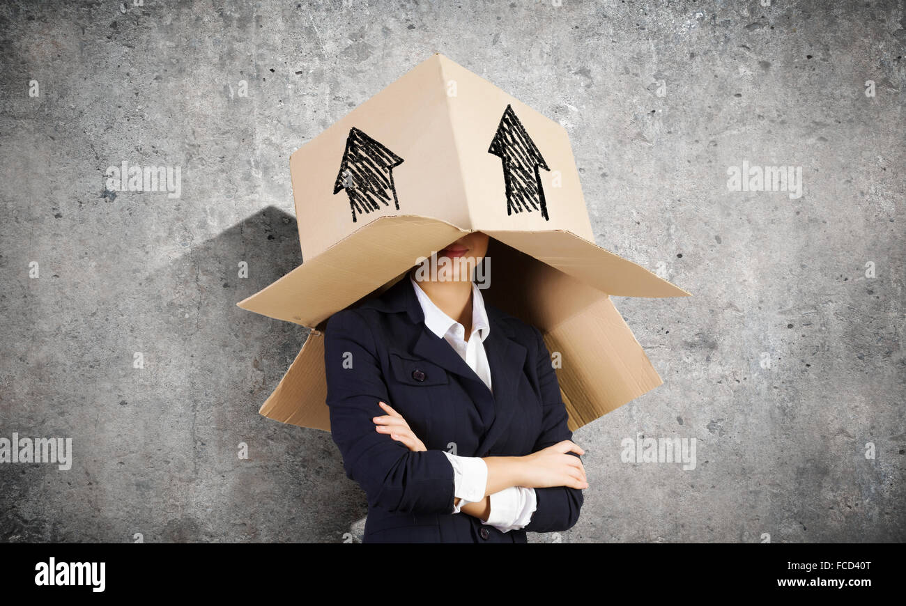Businesswoman wearing carton box with drawings on head Stock Photo - Alamy
