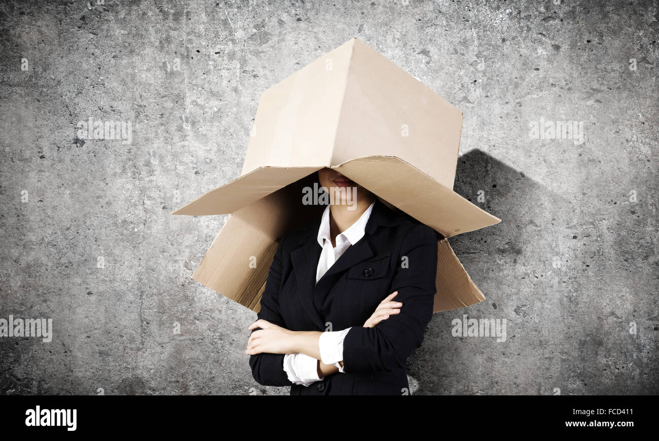 Confident businesswoman wearing carton box on head Stock Photo - Alamy