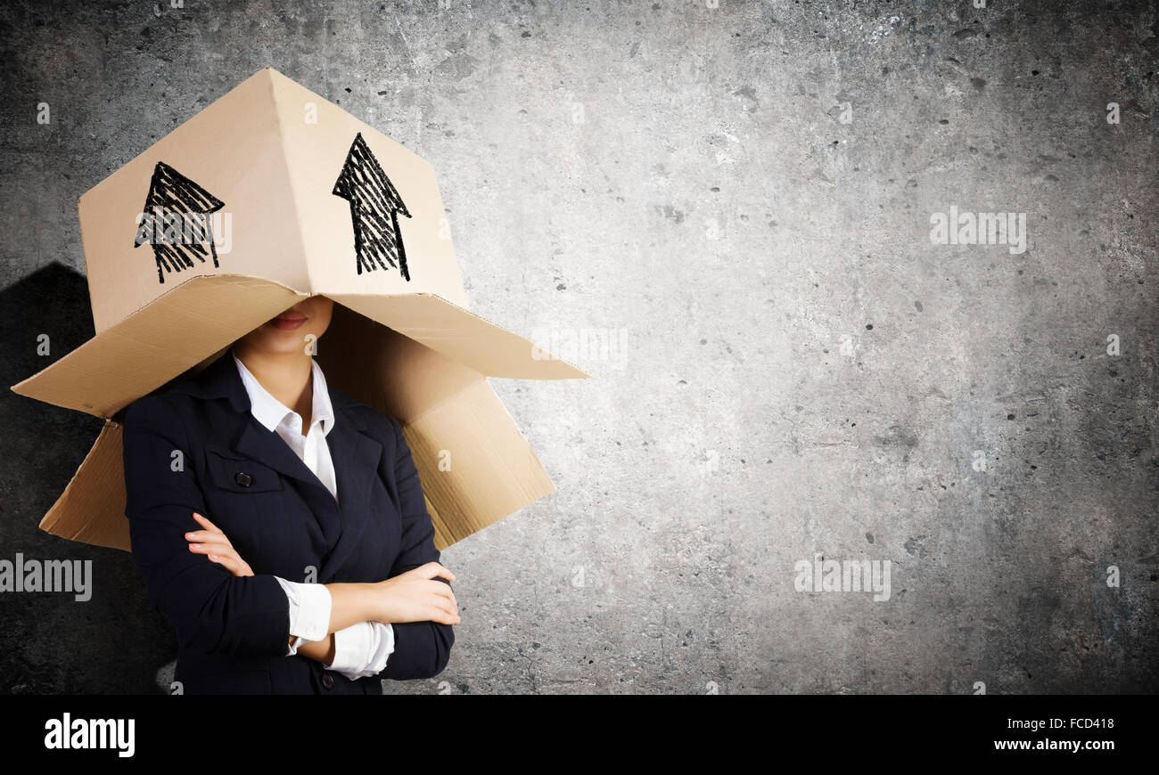 Businesswoman wearing carton box with drawings on head Stock Photo - Alamy