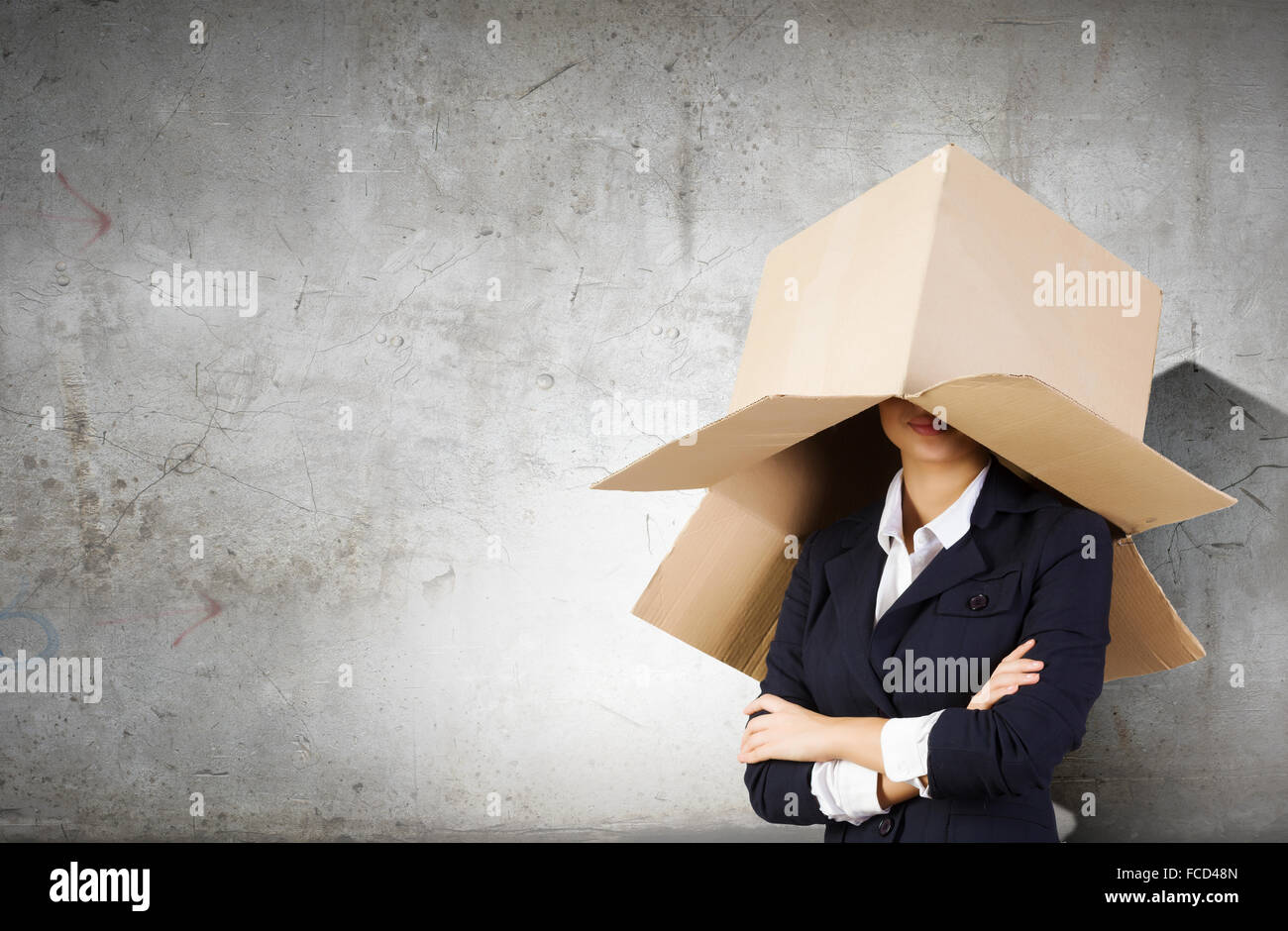 Confident businesswoman wearing carton box on head Stock Photo - Alamy