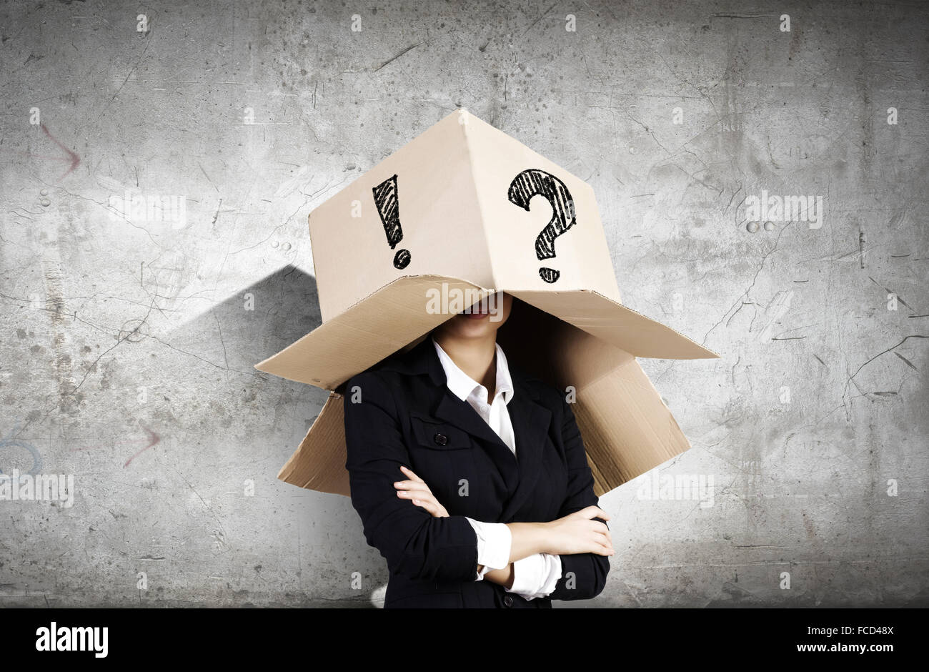 Businesswoman wearing carton box with marks on head Stock Photo - Alamy