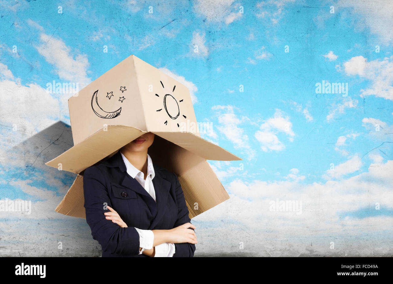 Confident businesswoman wearing carton box on head Stock Photo - Alamy