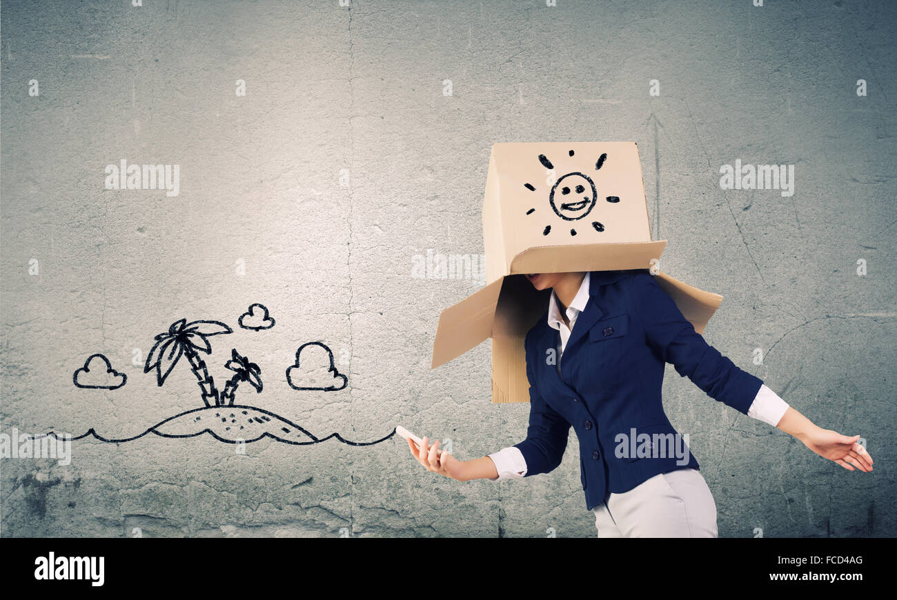 Businesswoman in suit wearing carton box on head Stock Photo - Alamy