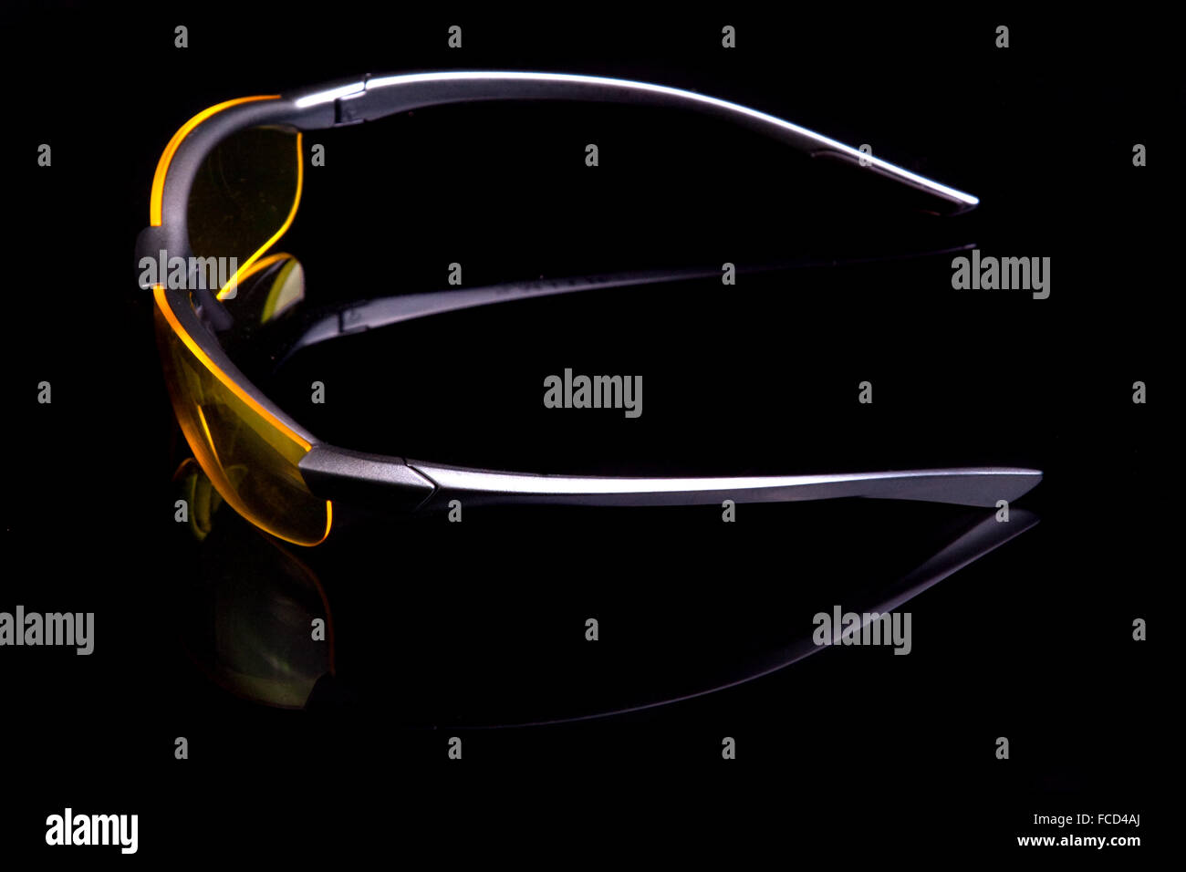 Yellow sunglasses. Side view Stock Photo - Alamy