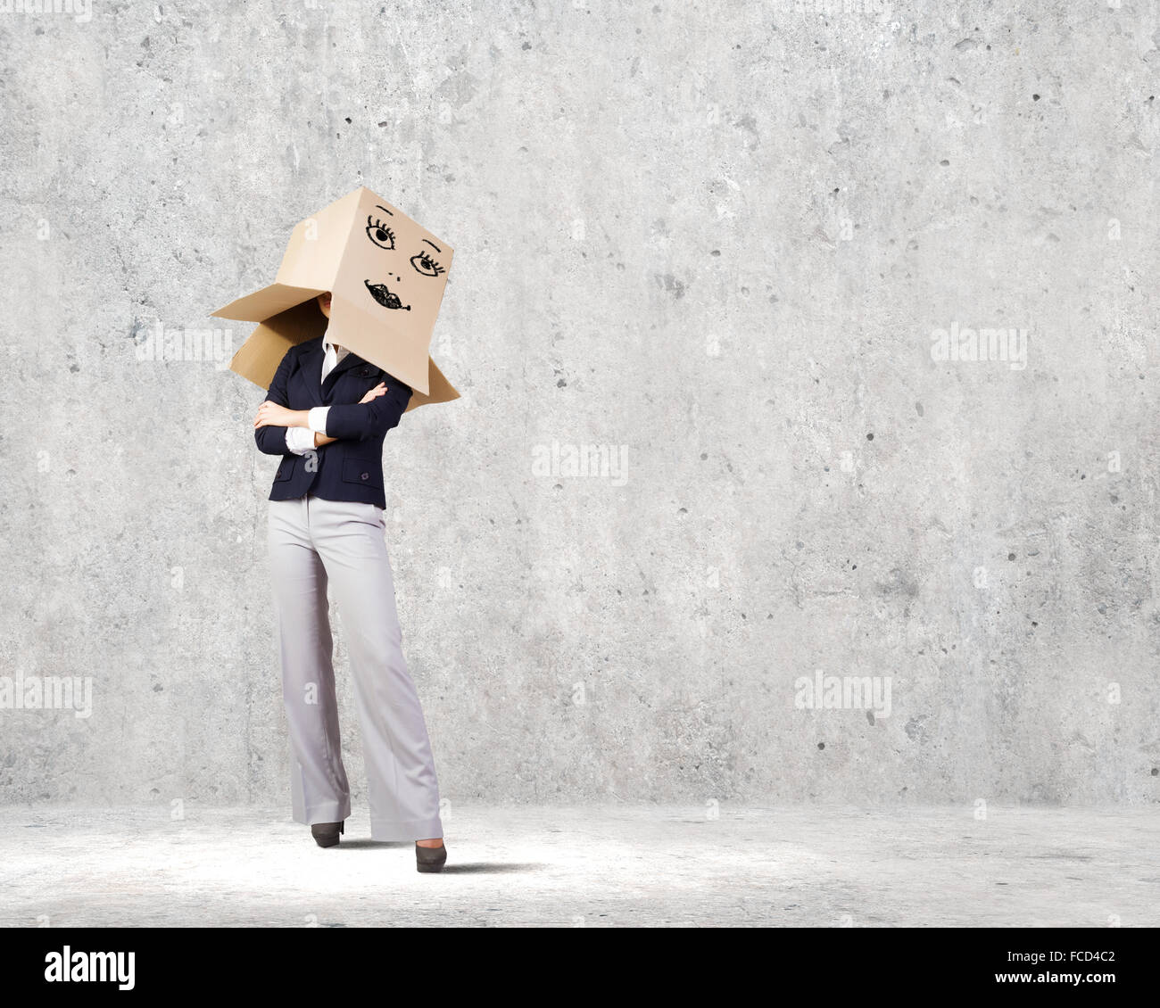 Confident businesswoman wearing carton box on head Stock Photo - Alamy